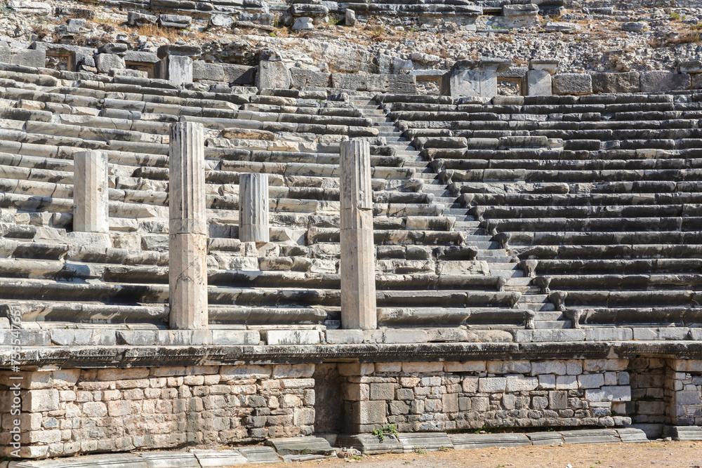 Theater at Miletus. Ancient stone theater seats and columns stand under ...