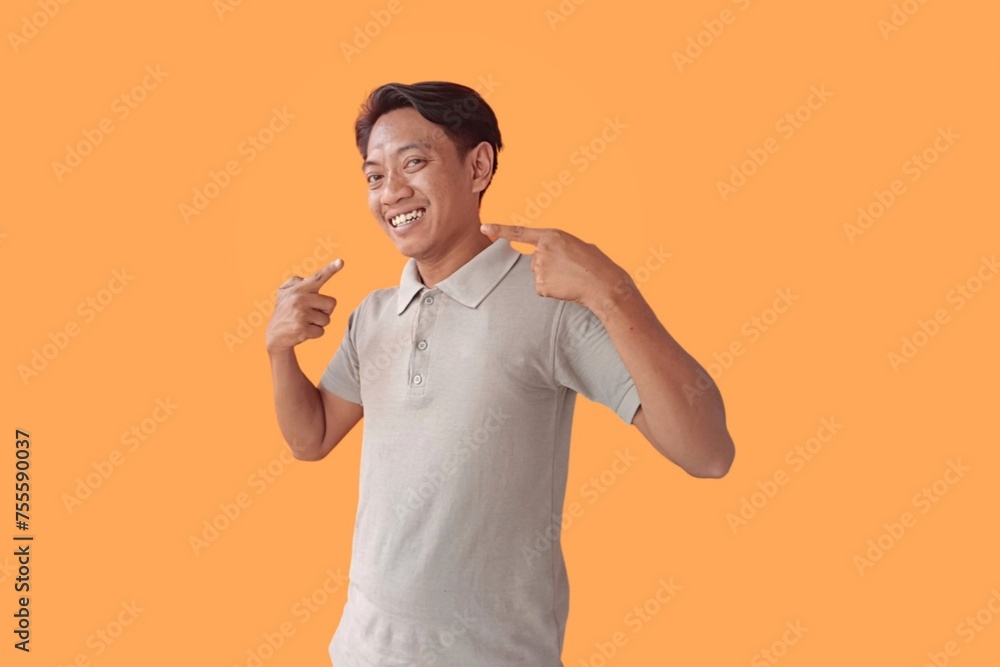 Handsome Asian man standing over orang background smiling with open ...