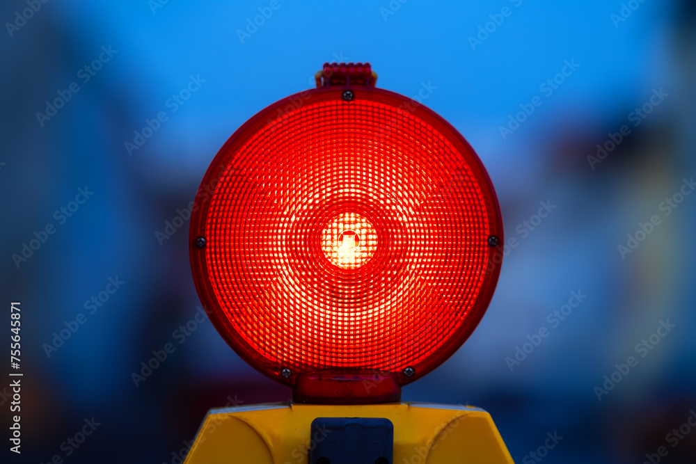 Traffic barring with a red battery flash lights indicating road closure ...