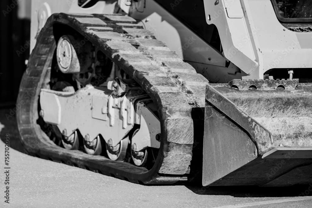Black and white photo of compact loader track skid loader side view of ...