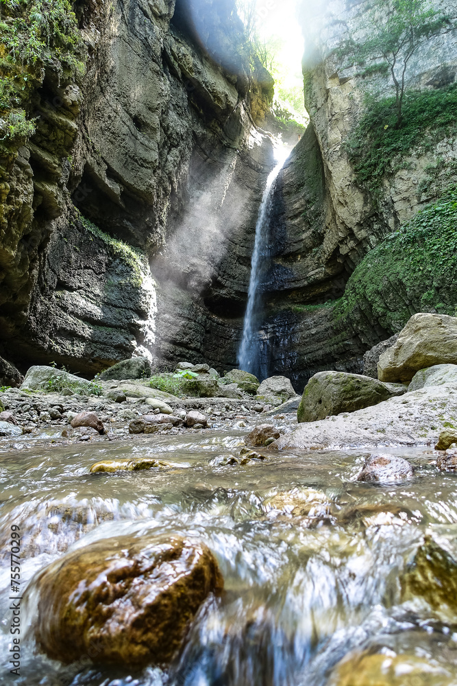 Beautiful waterfall Adai-Su in a unique place in the Chegem gorge. The ...