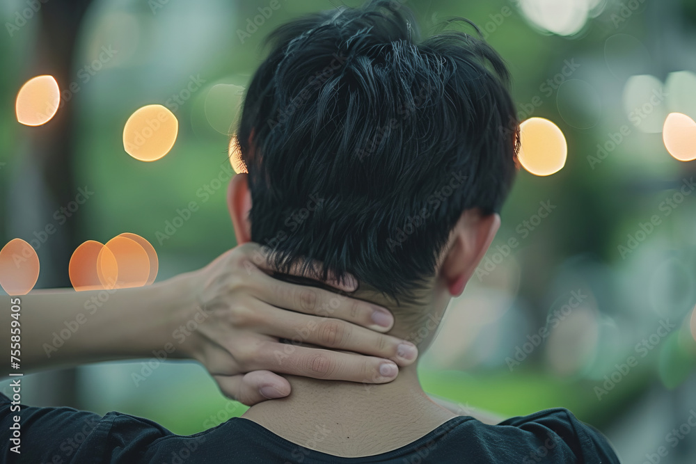 Person clinging to his neck with both hands and his face contorted in ...