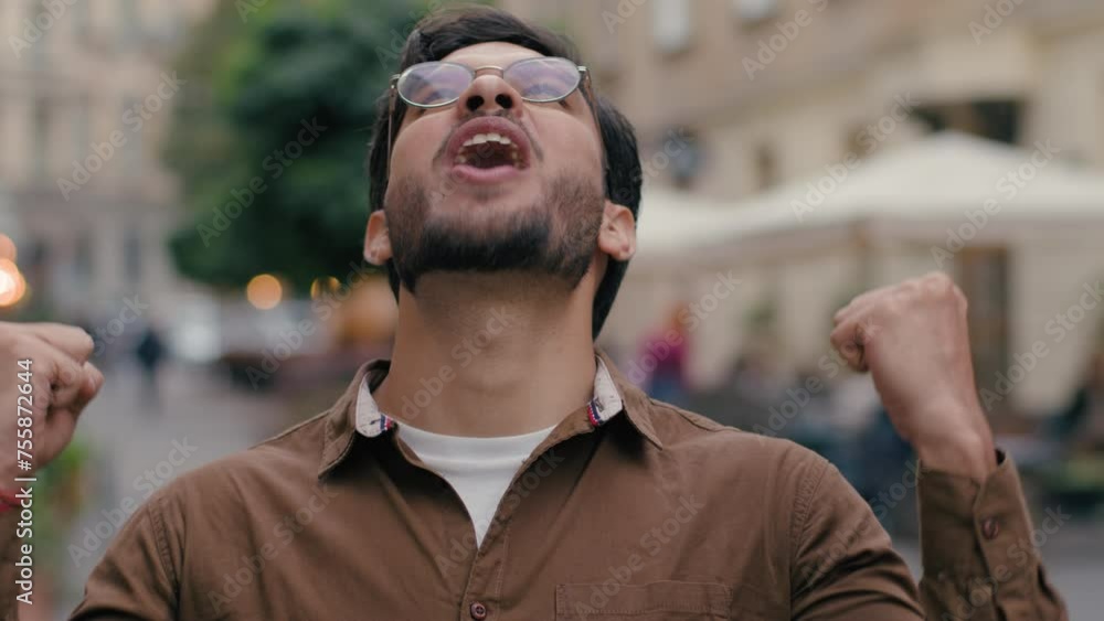Vidéo Stock Surprised happy Indian Arabian ethnic male student man guy ...