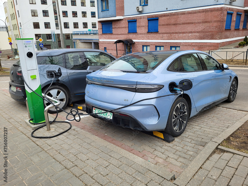 Minsk, Belarus. Mar 9.2024. BYD Seal EV car and BMW I3 charge battery ...