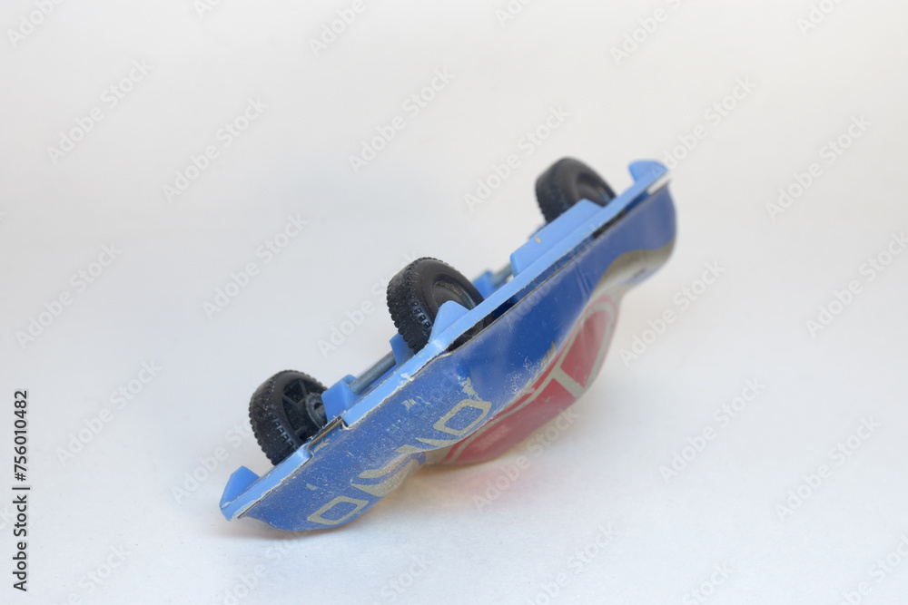 racing car. tin toy. laying on its roof, turbo rally toy car. showing ...