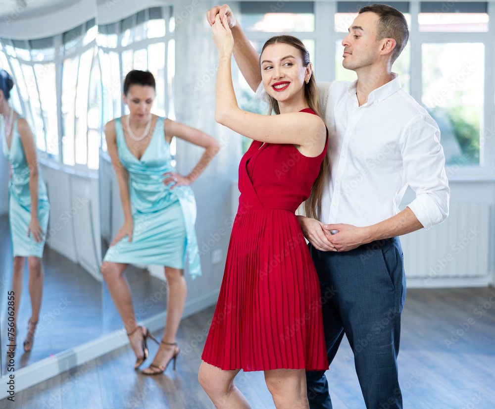 Couple learns dancing during individual lesson in classical and modern ...