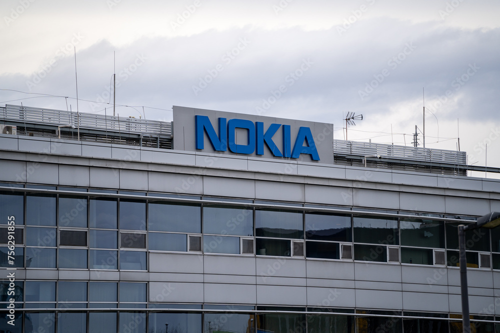 Nokia building with logo sign in Kraków. Telecommunications company ...