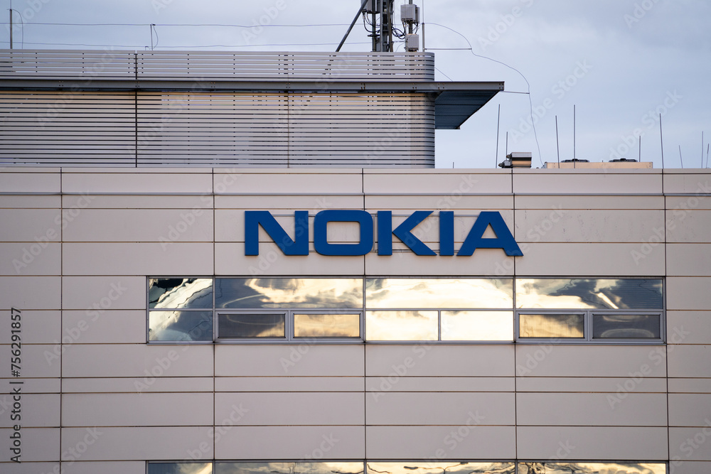 Nokia building with logo sign in Kraków. Telecommunications company ...
