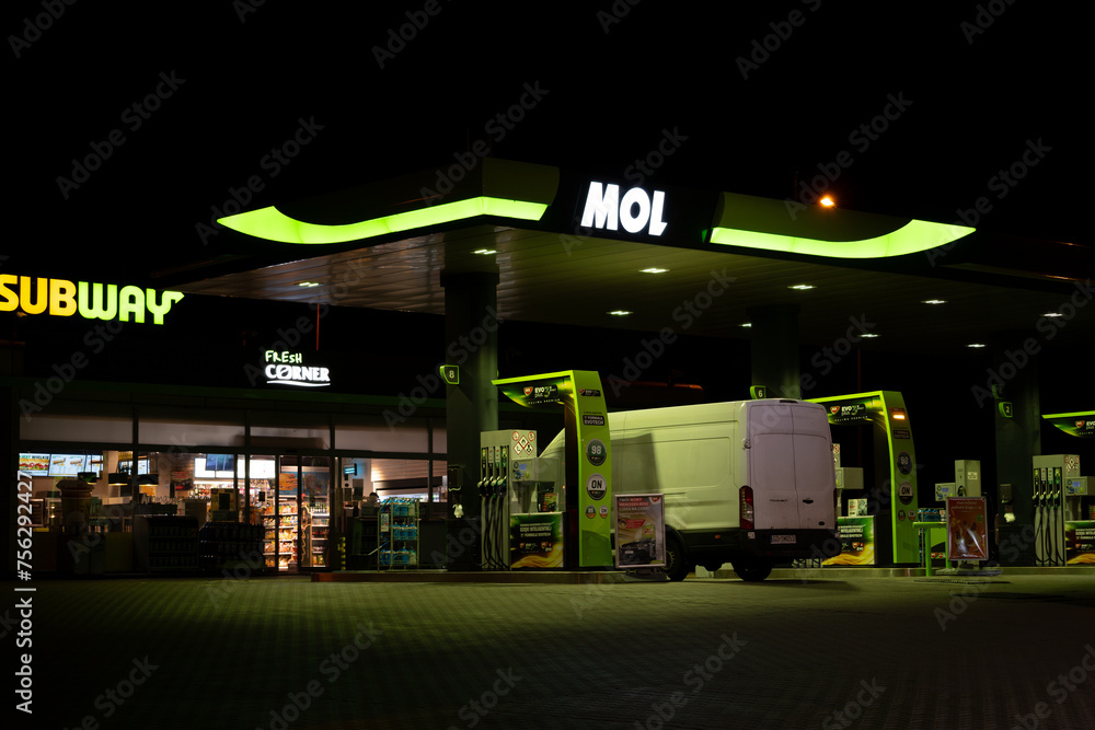 MOL gas station with logo sign. Hungarian oil company filling petrol ...