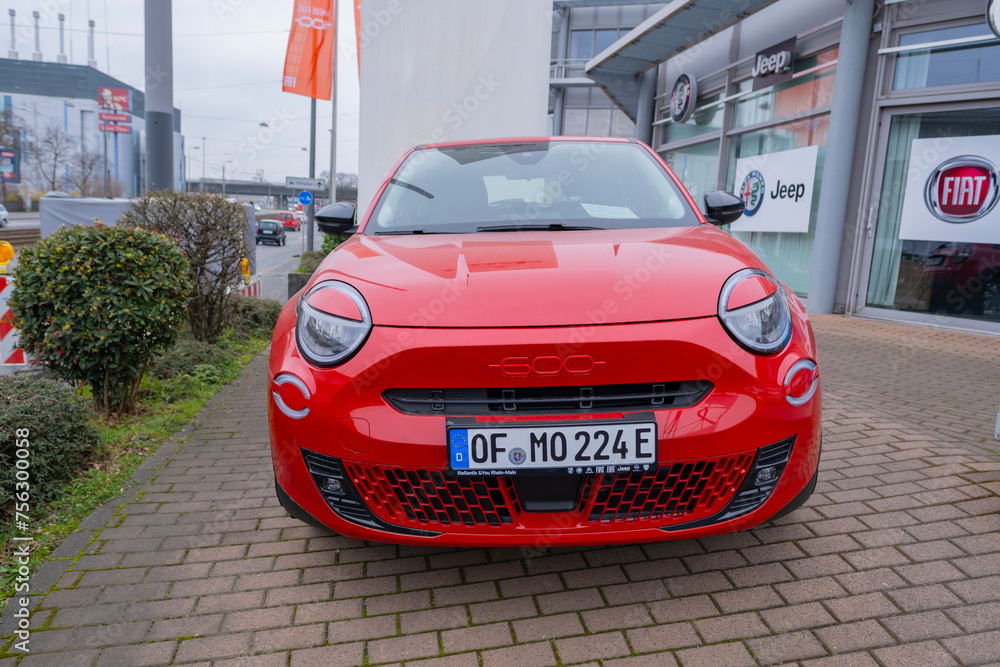 red electric Fiat 600 Е car parked in parking lot, Compact crossover ...