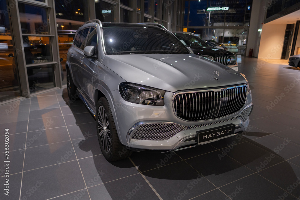 new electric silver Maybach GLS SUV, car in showroom, EV Mercedes-Benz ...