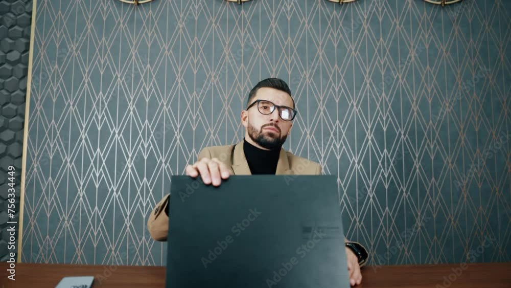 European middle-age boss manager sitting in the classical office with ...