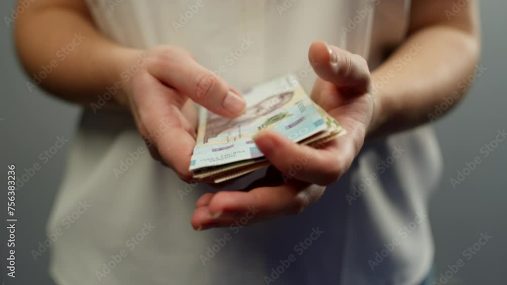 The womans gesture revealed her excitement as she held a bunch of money ...