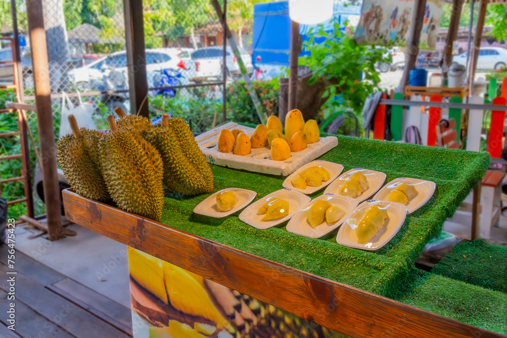 Street stall with exotic fruits Durian and Mango in Thailand. For the ...