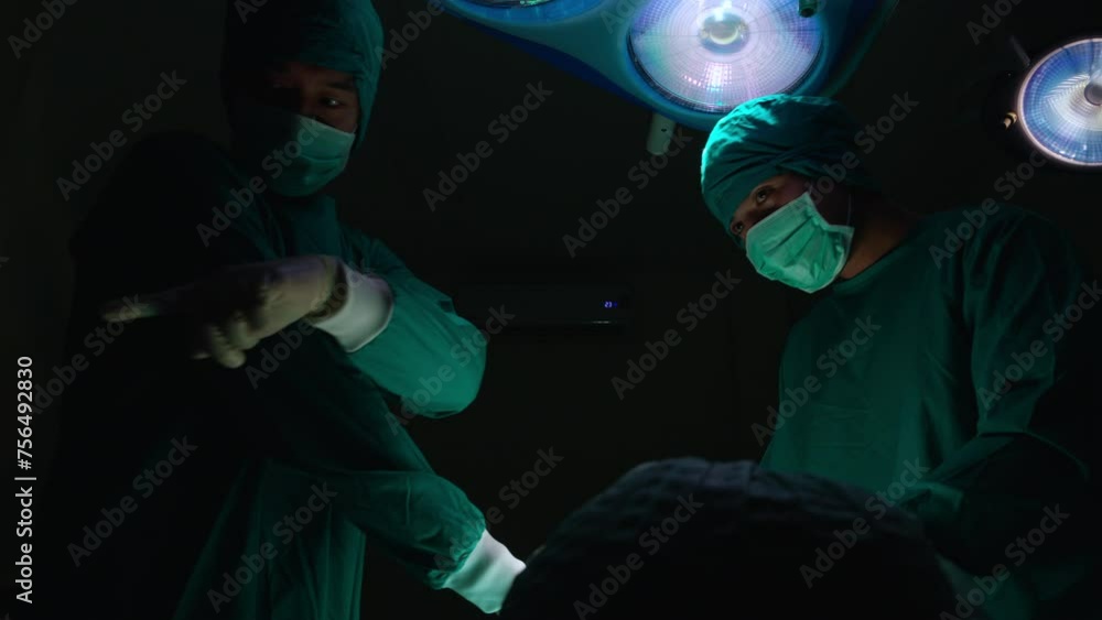 Group of team doctor and surgeon doing surgery with patient in the ...