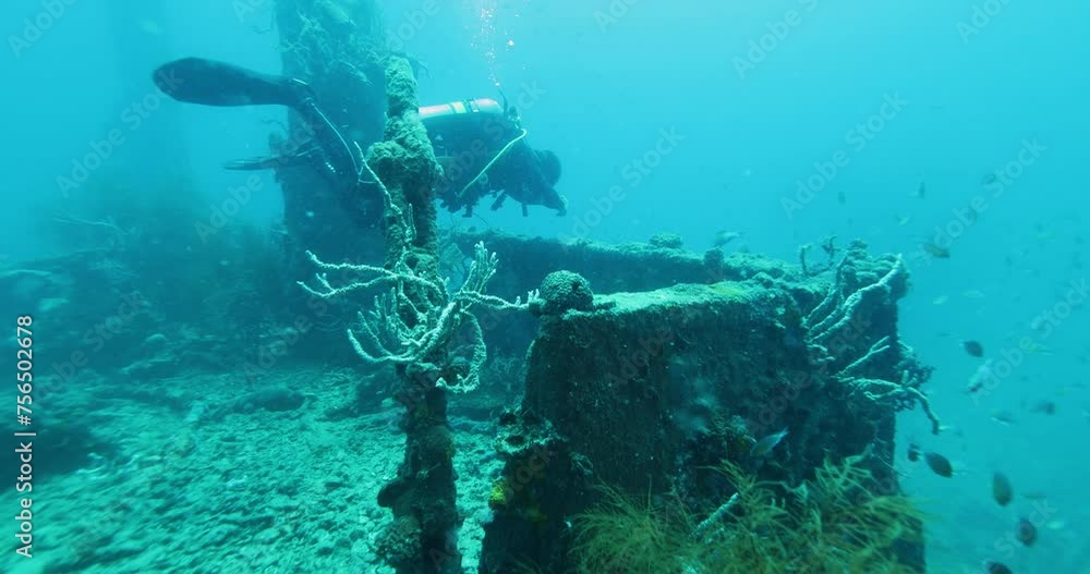 Scuba Diver Exploring Big Ship Wreck. The ship was Japanese and sunk ...