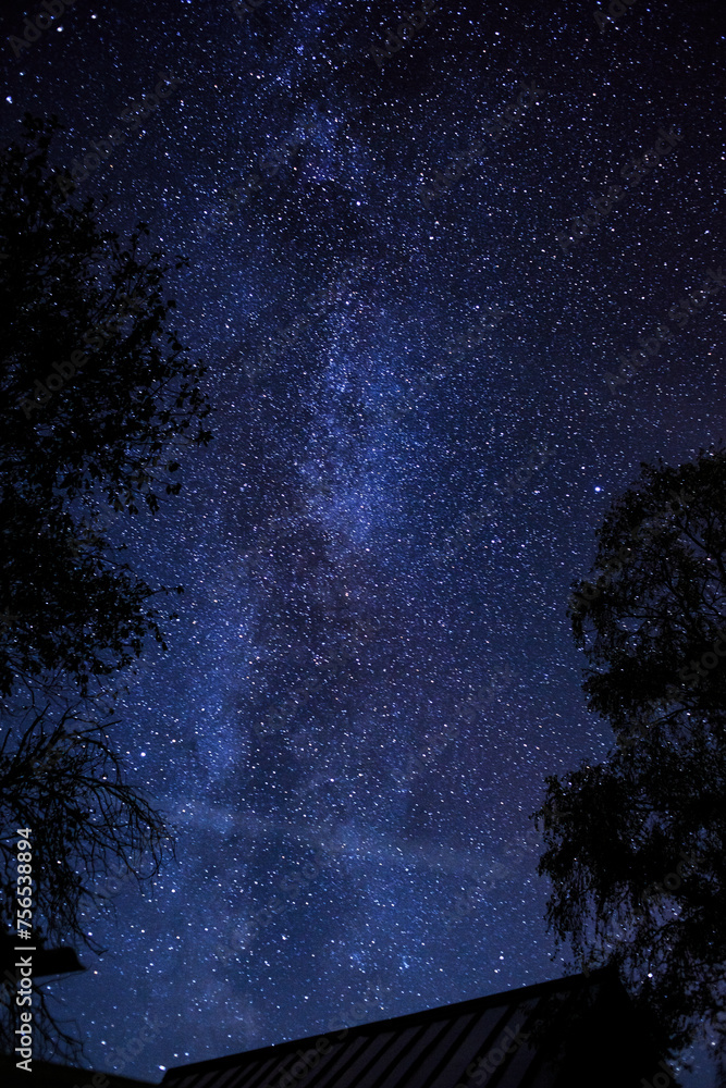 Starry sky with bright stars outside the city in the mountains, no one ...
