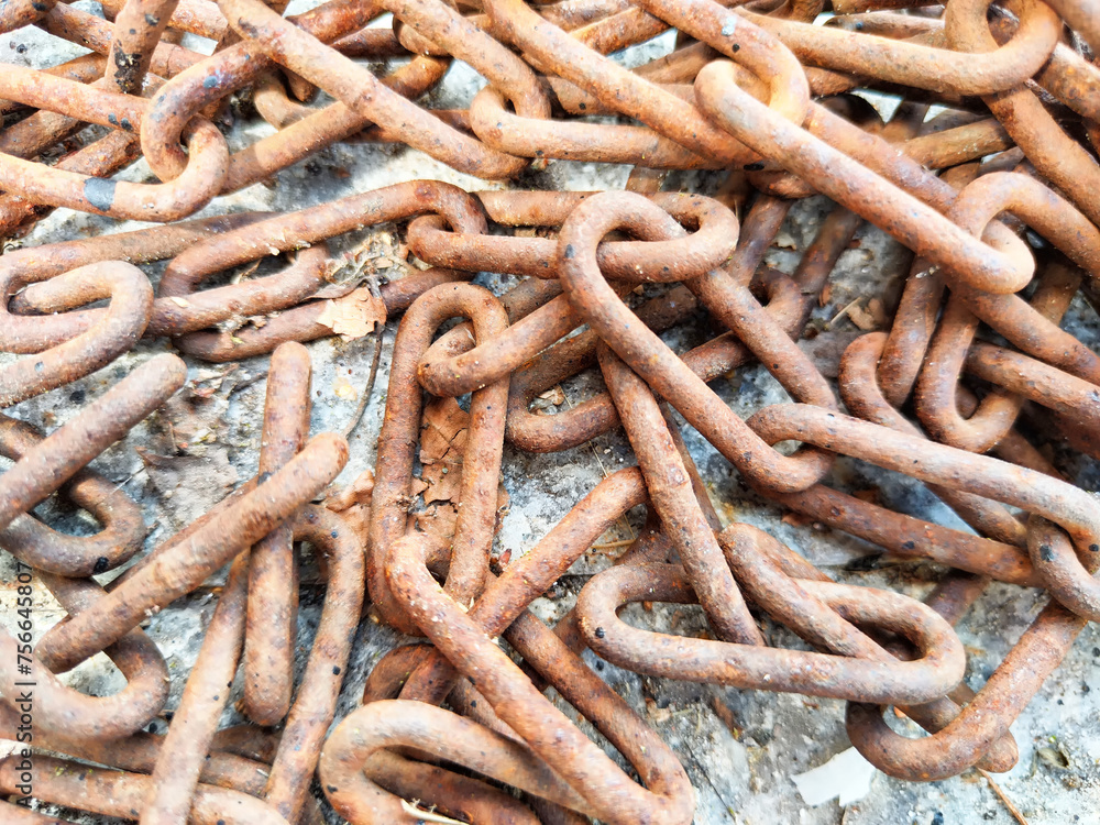 Rusty Metal Chains Piled on a Ground Surface. A heap of intertwined ...