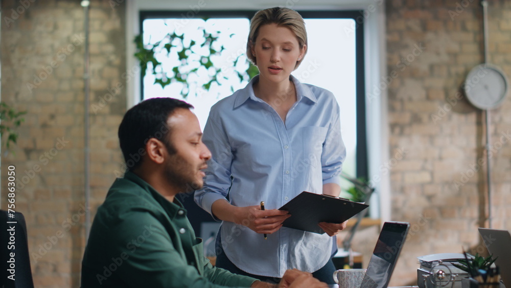 Ceo monitoring work colleagues sitting coworking space. Manager ...