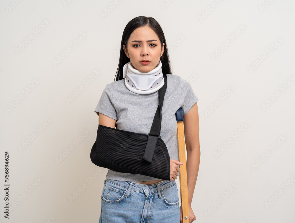 Foto de Depressed woman suffering from pain. Broken arm and leg. woman put on plaster cast ...