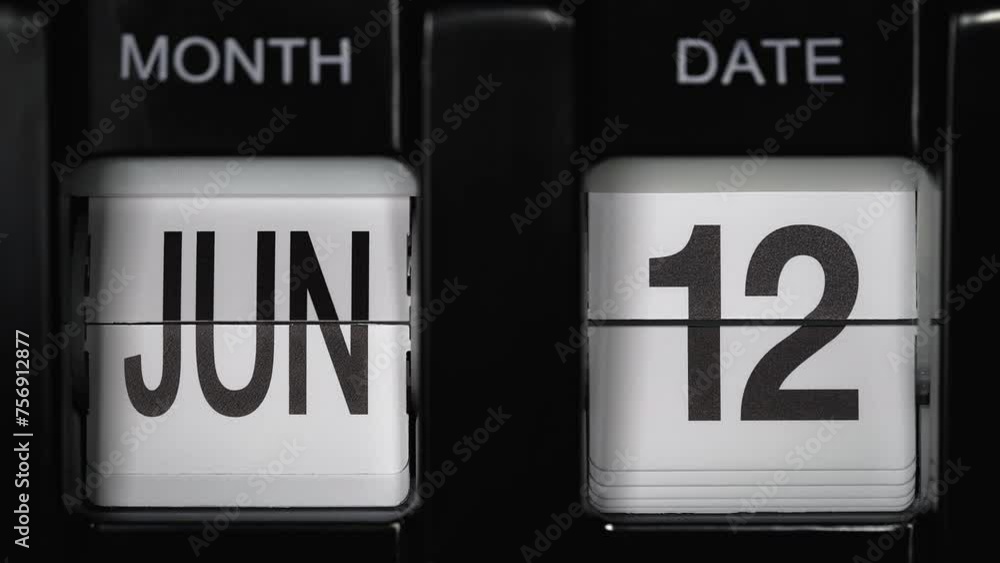 retro flip calendar with a date change from the eleventh of June to the ...