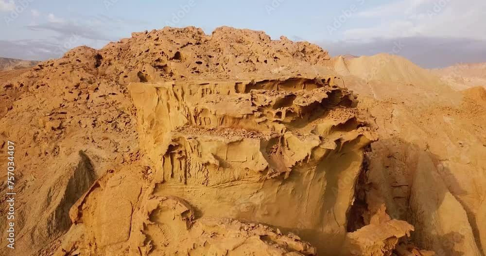 Fly back from wind erosion rock cliff landform the coastal marine sea ...