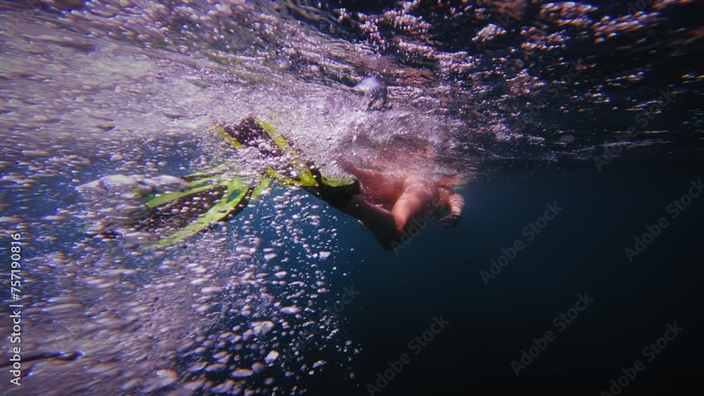 Woman freediver with fins dive to sea bottom. Freediving in blue ocean ...