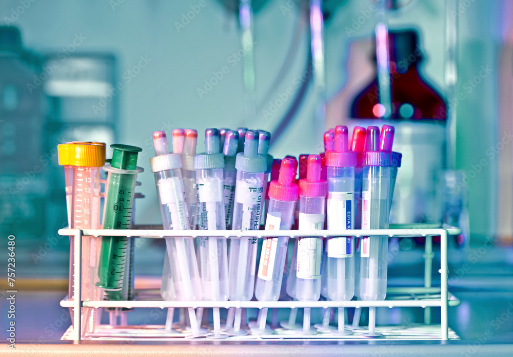 Laboratory test tubes in a rack with a scientific research background ...