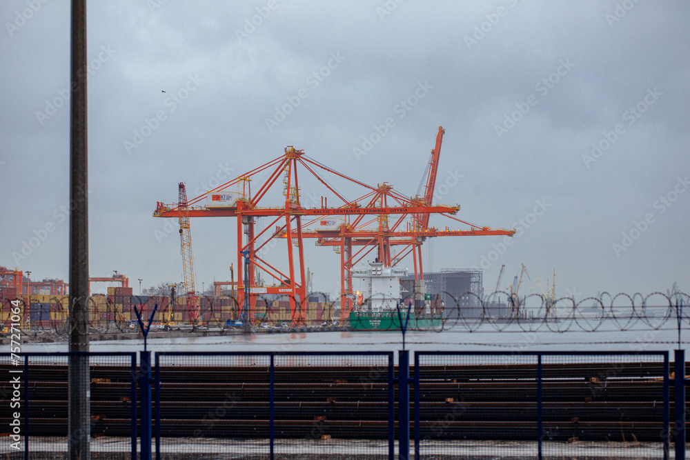 Gdynia, Poland - February 6th, 2024 - Transshipment of a container ship ...