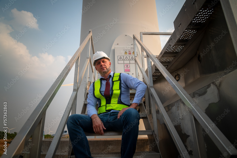 Engineer manager wearing uniform inspection work in wind turbine farms ...