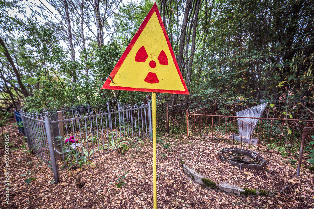 Radiation warning sign on a cemetery in Pripyat abandoned city in ...