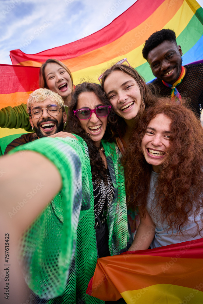 A crowd of happy people in colorful smile for a vertical selfie with a ...