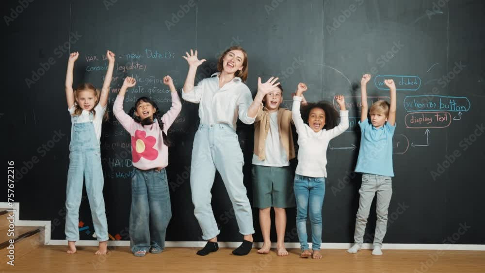 Multicultural student and teacher smiling and waving hand at blackboard ...