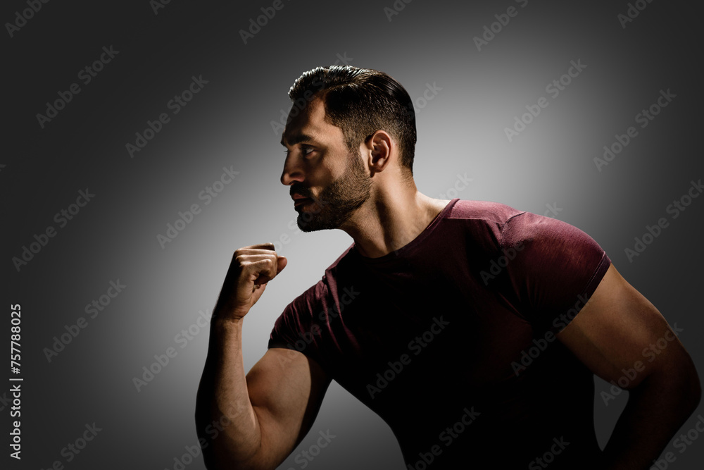 Fashion portrait of brutal strong muscular man posing on studio ...
