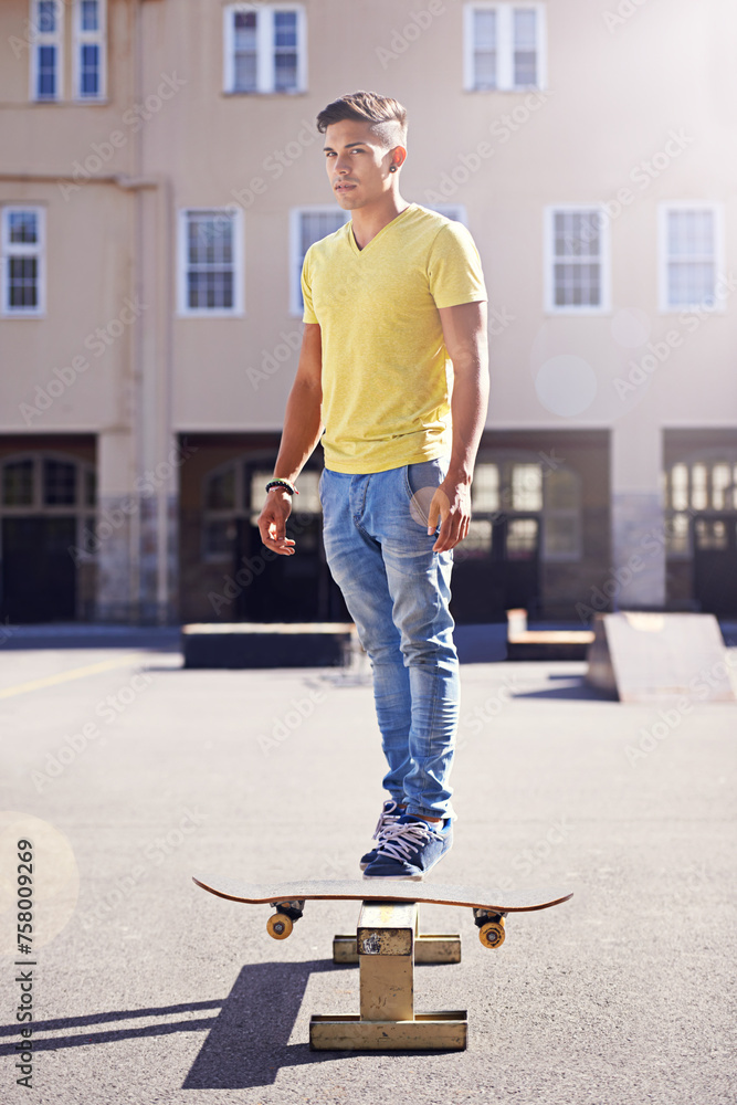 Man, skateboard and balance at urban skatepark, sports and skill with ...