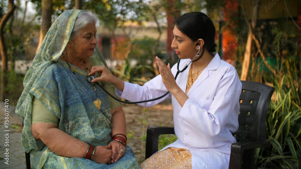 Beautiful Indian lady doctor examining an old woman in village - nurse ...
