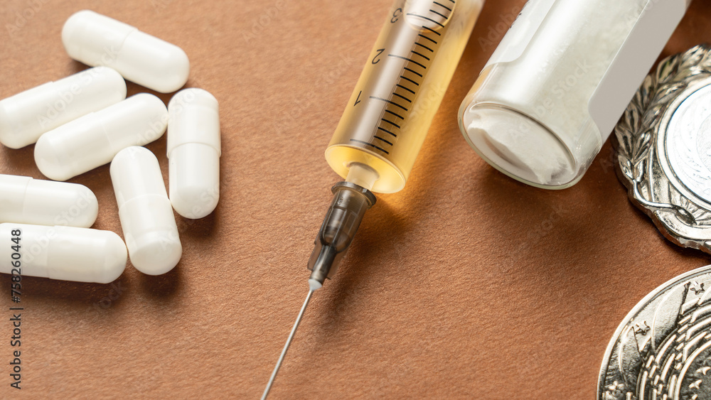 Syringe with doping and pills close-up, doping concept in sports. Stock ...