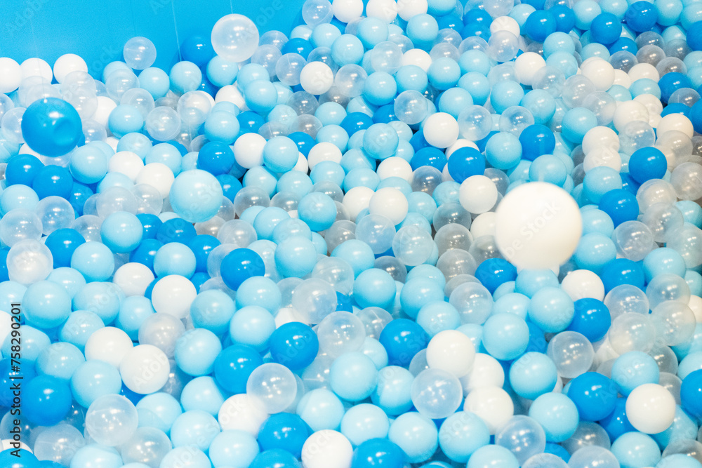 Colored plastic balls in pool of kindergarten school,White and blue ...