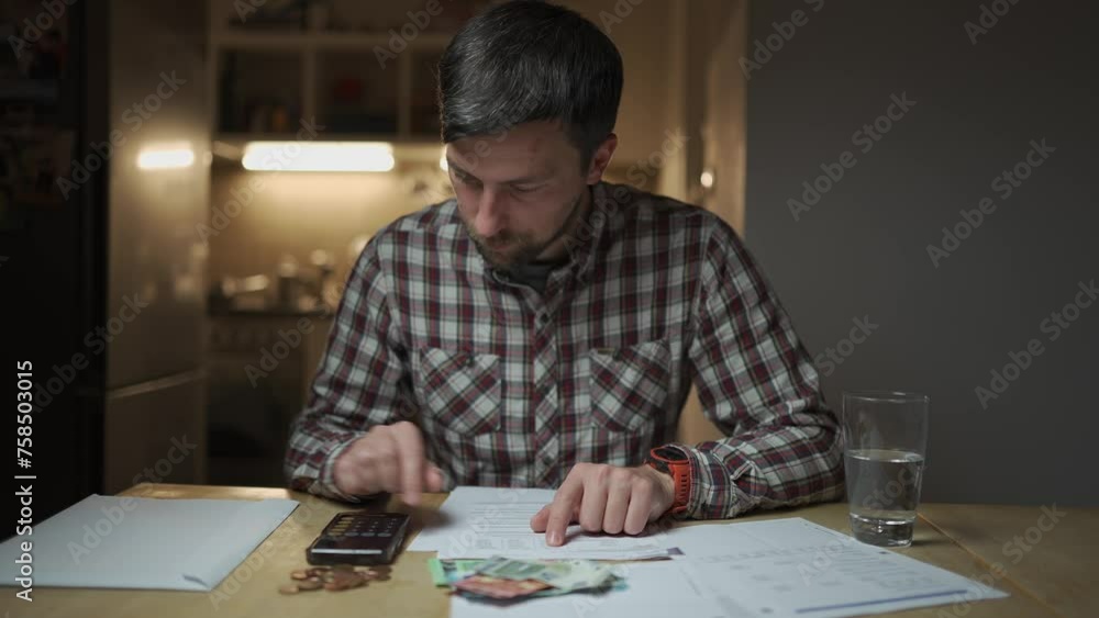 Vidéo Stock Financial problems. Sad man trying to find solution to ...