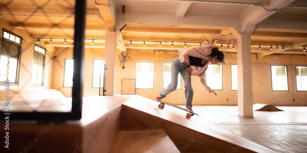 skater woman person playing skateboard in sport gym, young Asian woman ...
