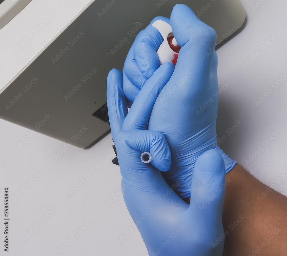 Scientist pipetting sample for PCR test at PCR machine. pipette into ...