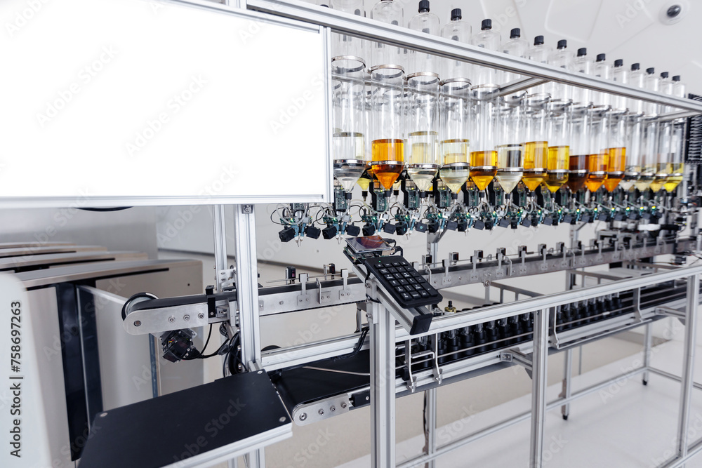 Perfume manufacturing process, overhead view of high tech filling ...