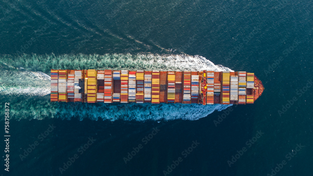 Aerial top view of cargo ship with contrail in the ocean sea ship ...