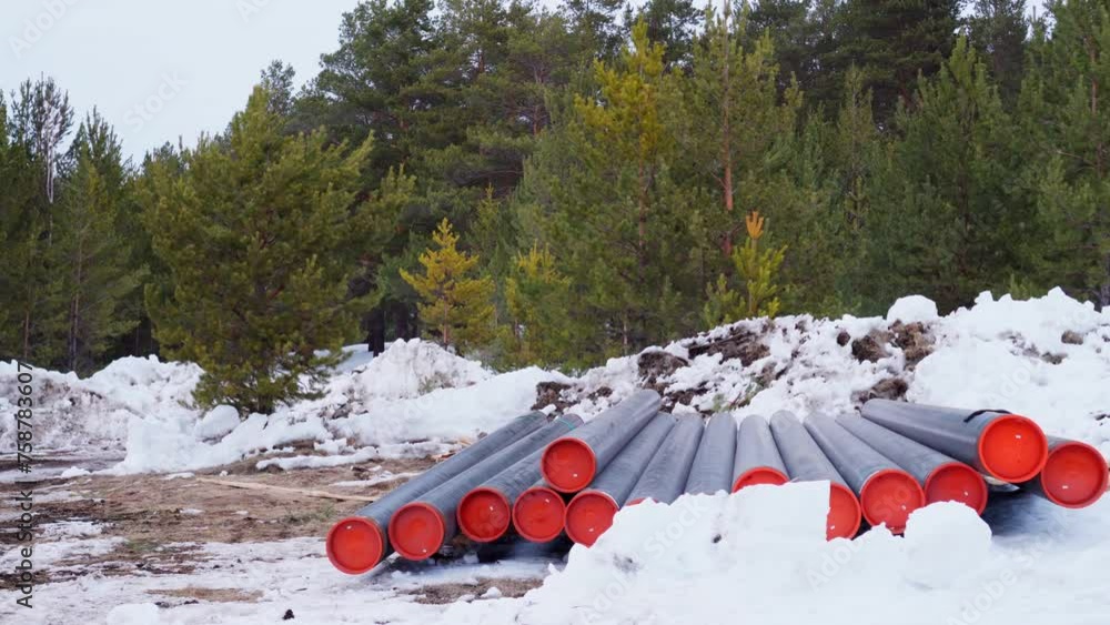 Laying a new gas pipeline line in winter. A large diameter gas pipeline ...