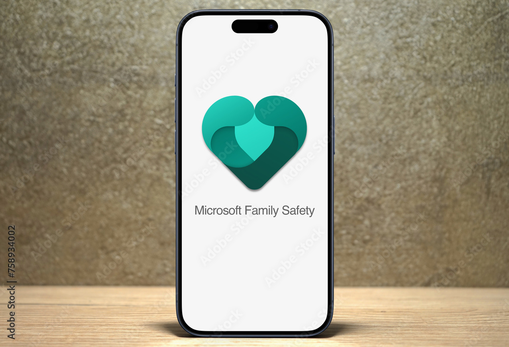 Microsoft Family Safety logo is displayed on a modern smartphone ...