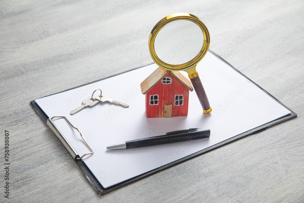 Magnifying glass, house model, pen, keys on the clipboard. Stock Photo ...