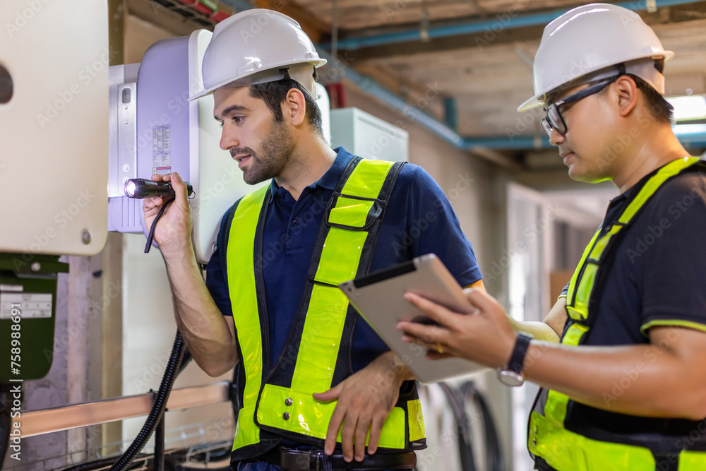 Electrical engineer working in control room. Electrical engineer man ...