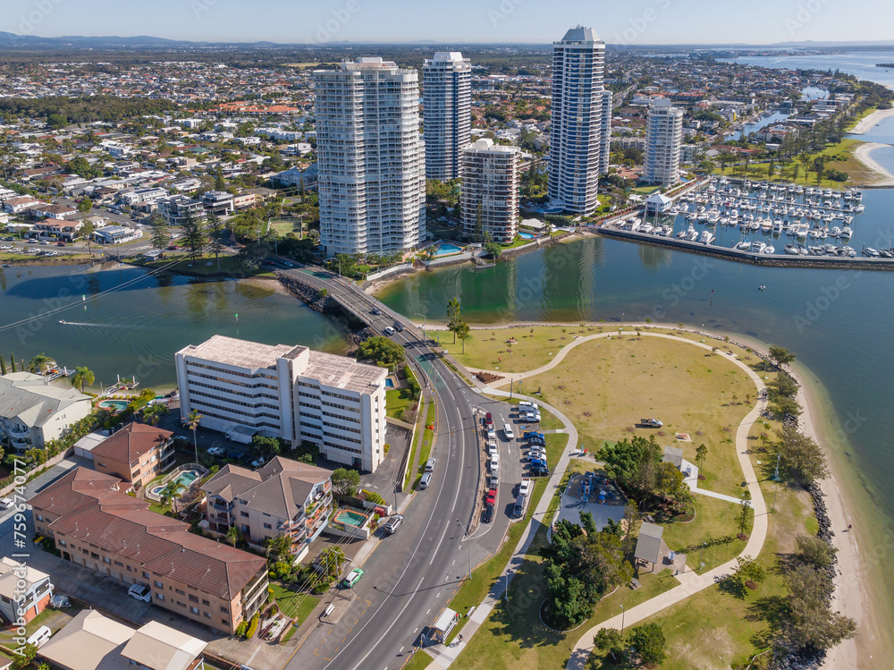 Aerial view of waterfront esplanade crossing a bridge below high rise ...