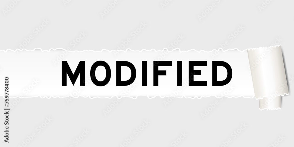 Ripped gray paper background that have word modified under torn part ...