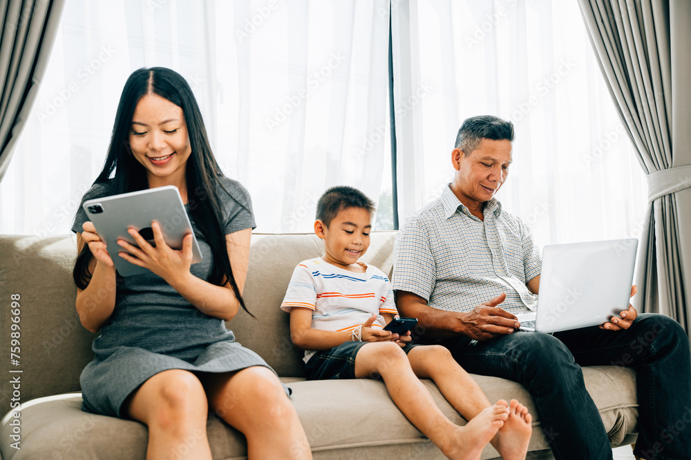 Parents kids engaged with laptops and phones ignoring familial bonding ...